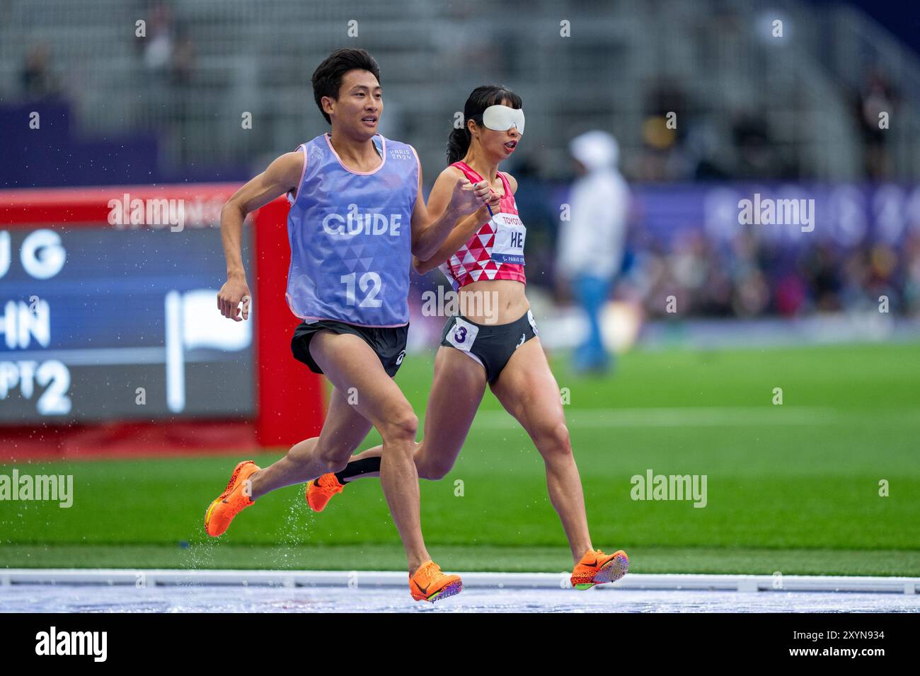Paris, France. 30th Aug, 2024. He Shanshan (R) of China and her guide You Junjie compete in the ...