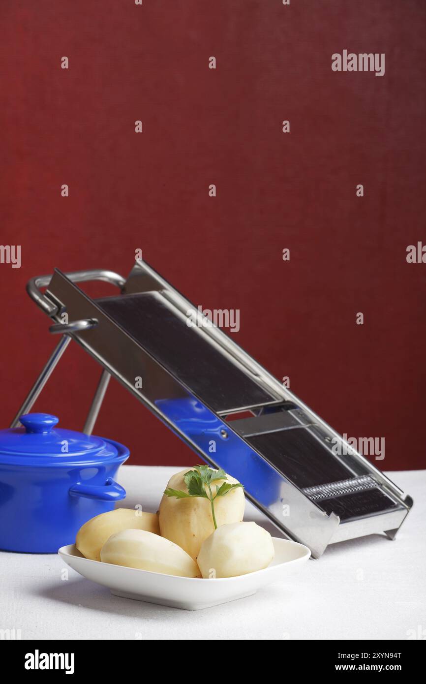 Mandolin and potatoes Stock Photo - Alamy