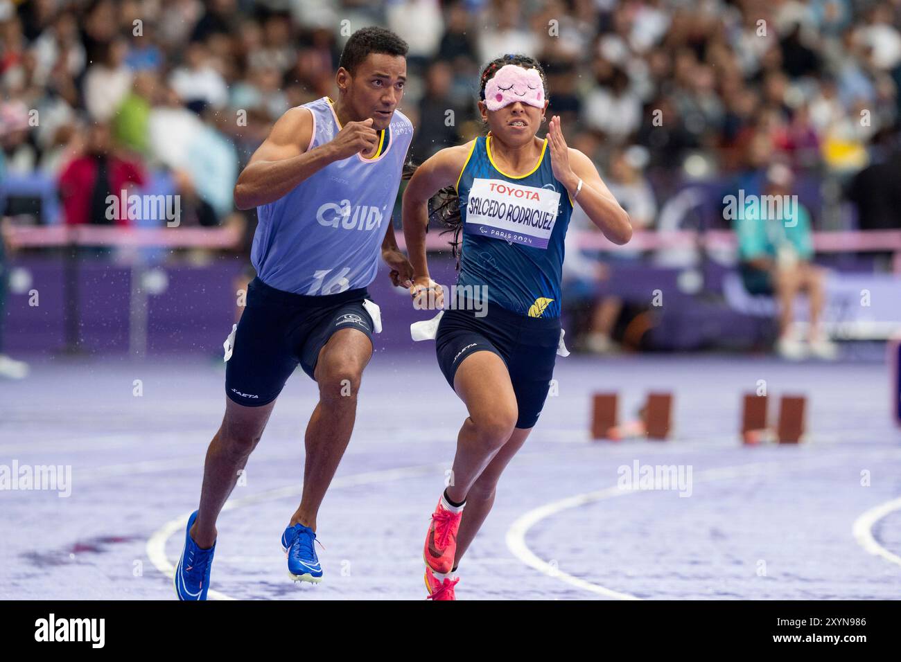 Paris, France. 30th Aug, 2024. Ionis Dayana Salcedo Rodriguez (R) of Columbia and her guide ...