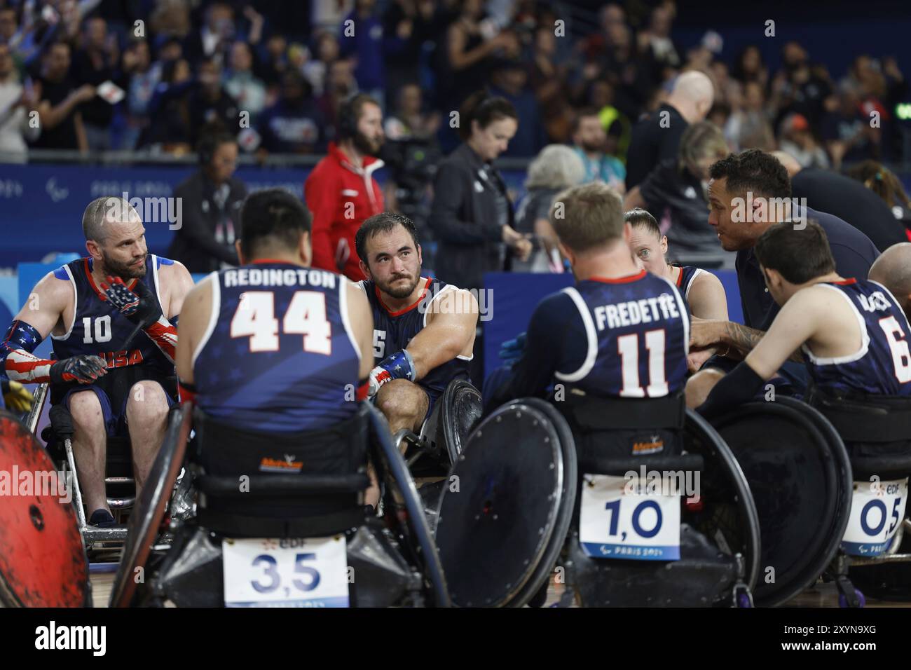 U.S. wheelchair rugby team huddle after their loss against Japan in the ...