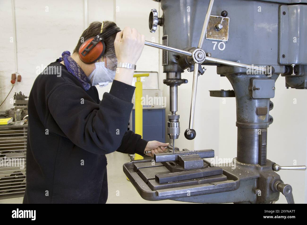 Metal worker with drilling machine Stock Photo - Alamy