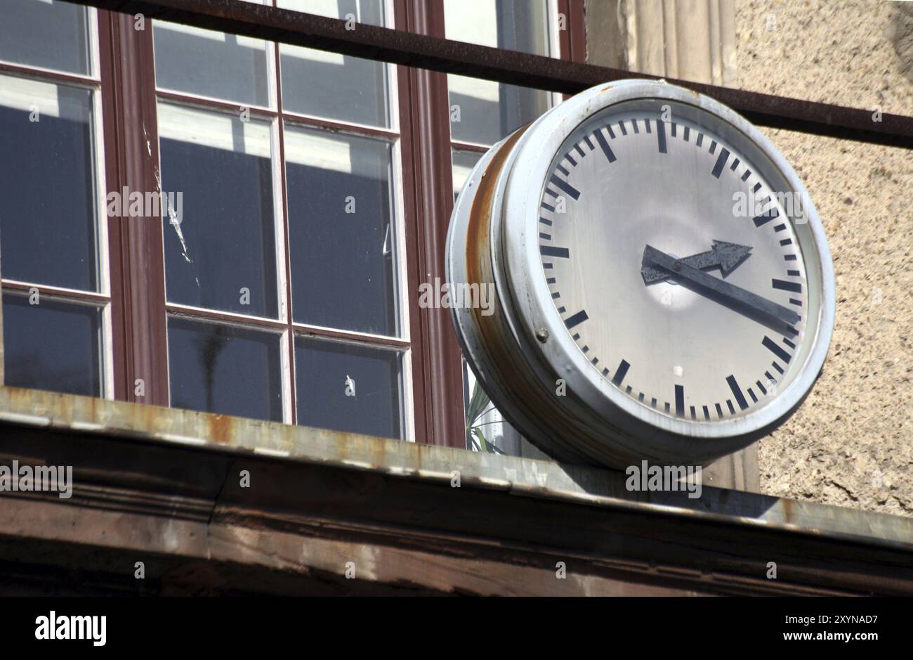 Rotten clock on a dilapidated school building Stock Photo - Alamy