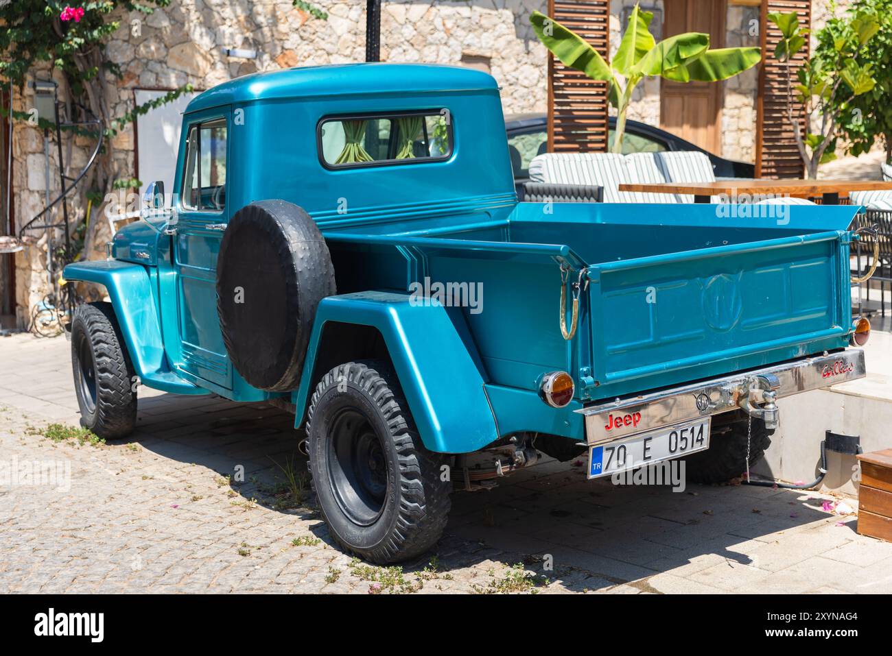 Kalkan, Turkey - August 15, 2024: Blue pick-up stands parket on the ...