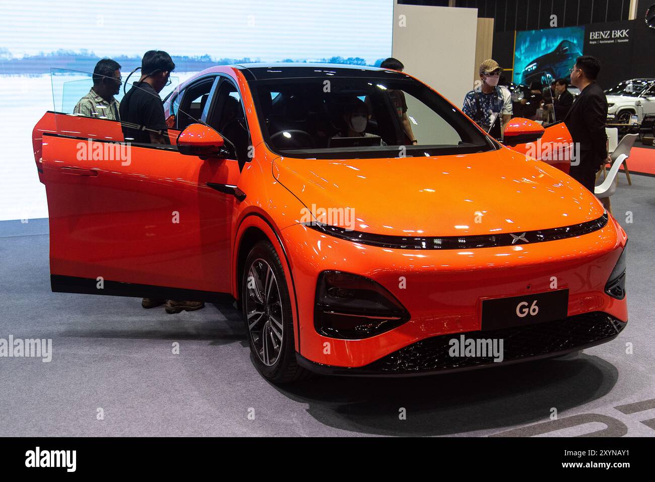 Bangkok, Thailand. 30th Aug, 2024. Visitors inspect a Xpeng G6 car ...