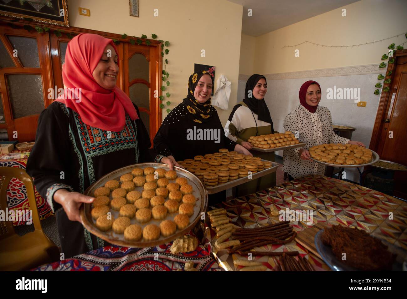 Gaza Strip, Palestine. 01 May 2022: Palestinian women makes sweets ...