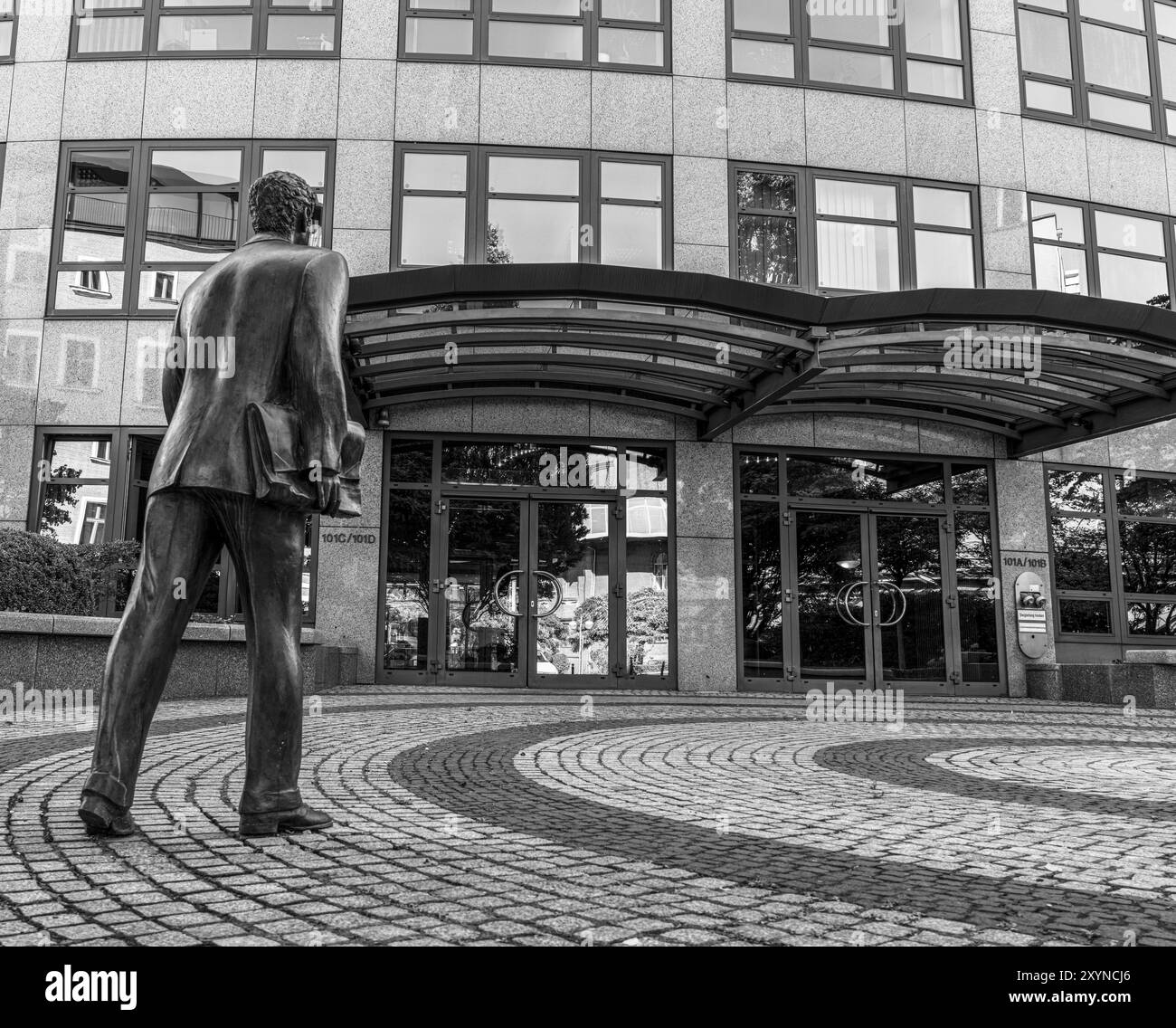 Black and white photograph, male bronze figure, depiction of ...