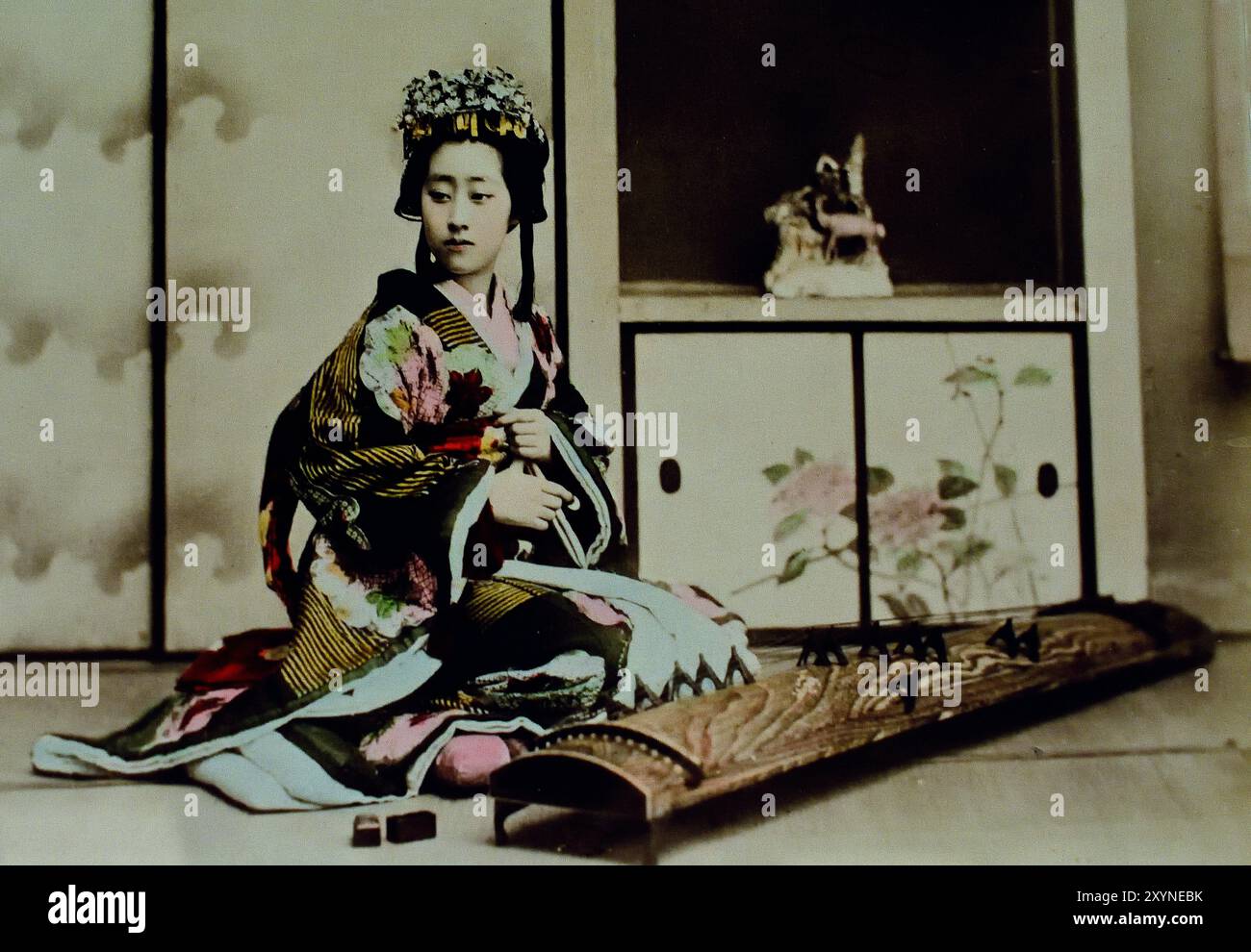 Portrait of O en ( O en is shown here with a Japanese zither or koto ...
