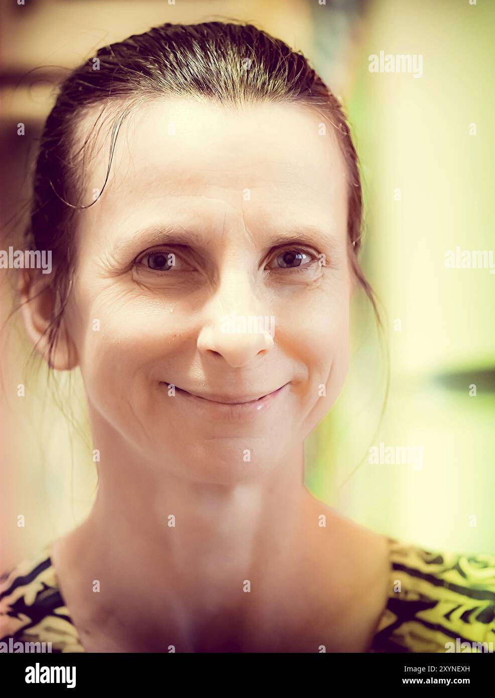 Mature woman looks camera smiles hi-res stock photography and images ...