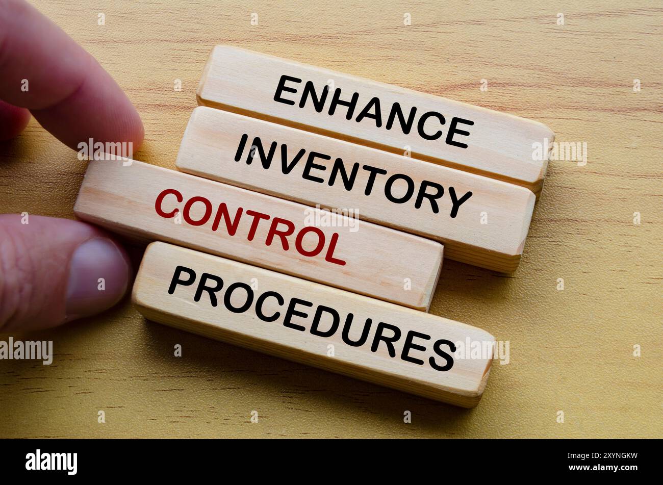 Enhance Inventory Control Procedures text on wooden blocks. Operational ...