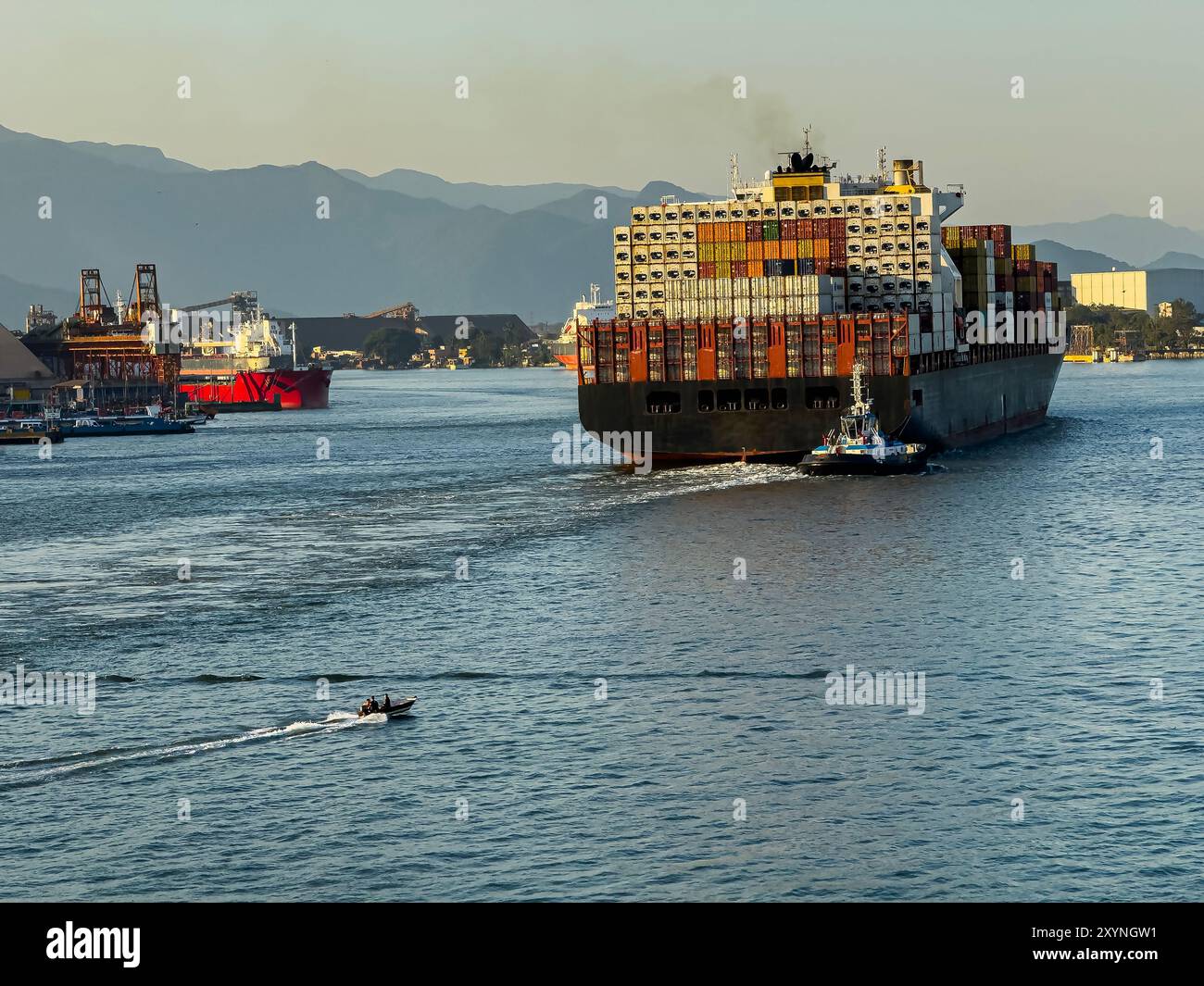 Cargo ship entering a city Stock Photo - Alamy