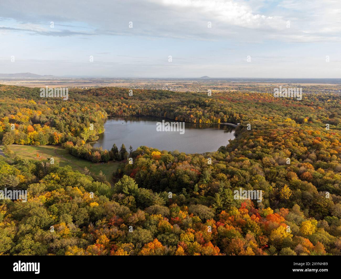 Aerial view of Lac du Moulin in fall season. Autumn leaf color lake and ...