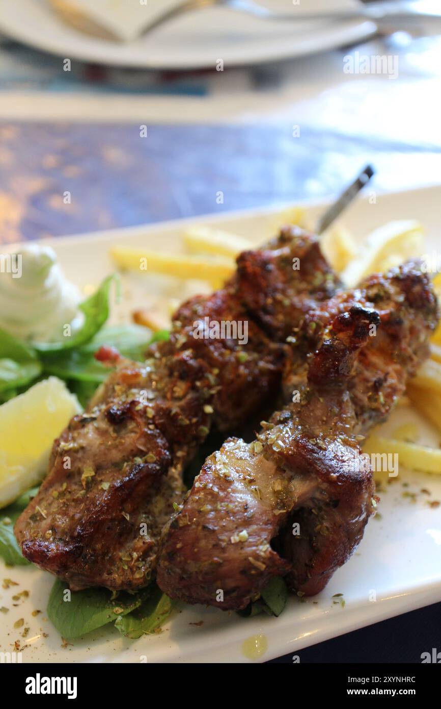 Greek cuisine: pork souvlaki (grilled pork Stock Photo - Alamy