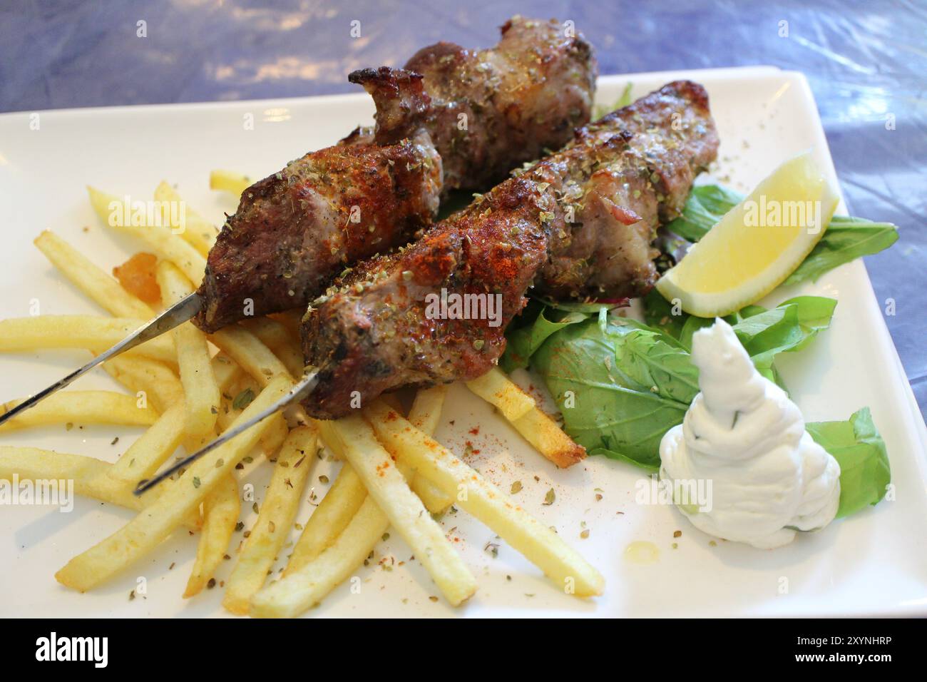 Greek cuisine: pork souvlaki (grilled pork Stock Photo - Alamy