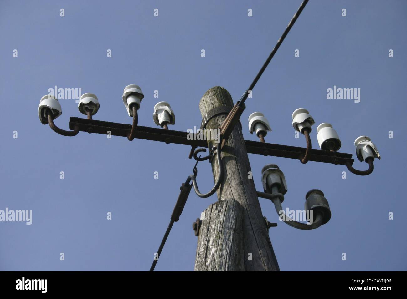Old electricity pylon with ceramic insulators Stock Photo - Alamy