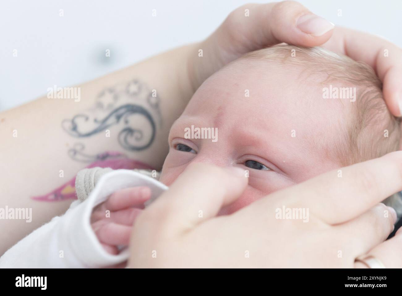 A baby being stroked. Baby at strokeing Stock Photo - Alamy