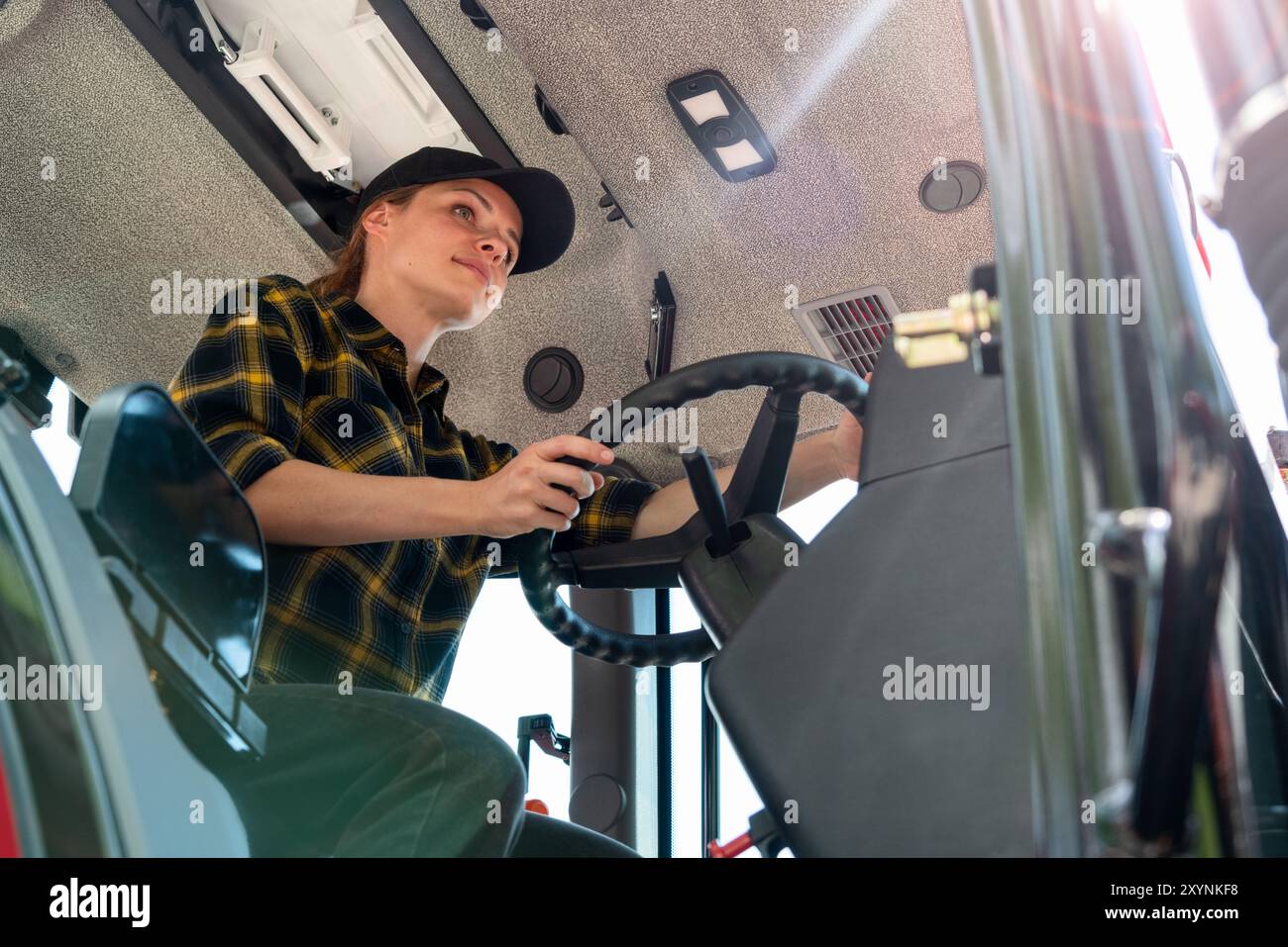 Woman driving tractor hi-res stock photography and images - Alamy