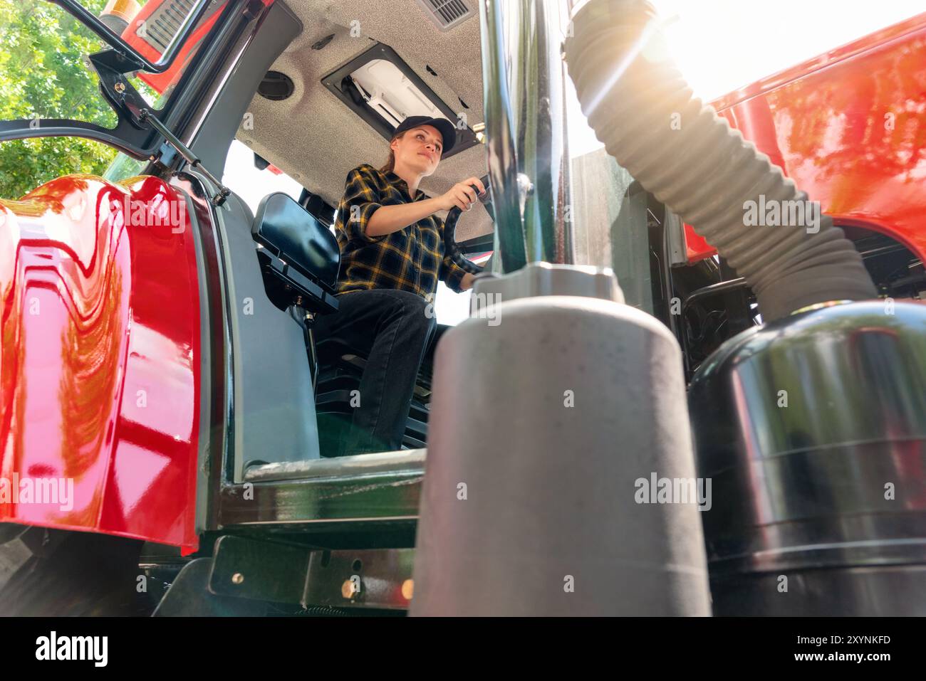 Woman driving tractor hi-res stock photography and images - Alamy