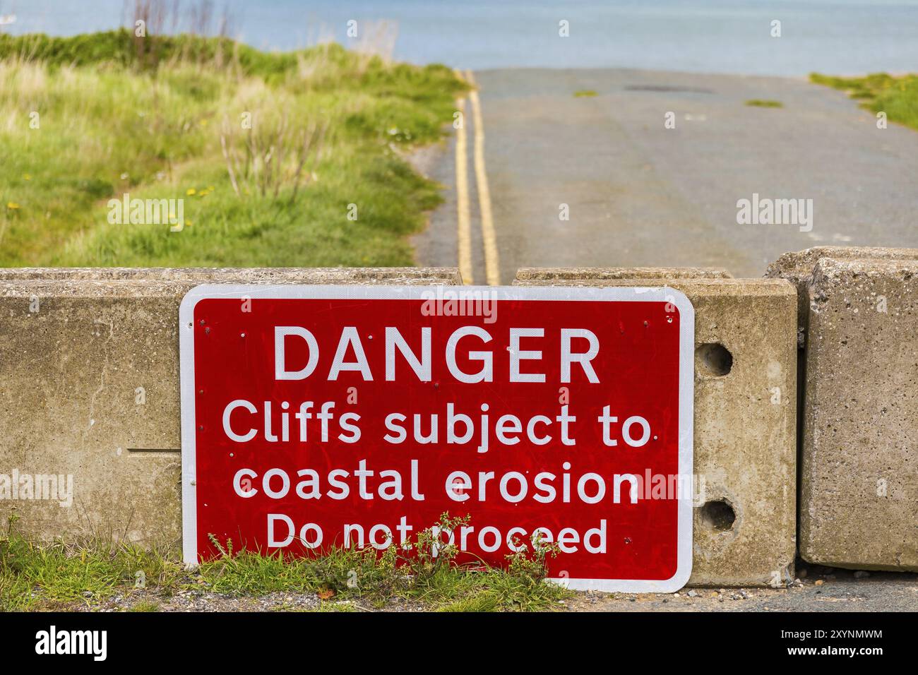 Warning signs on the closed road to the coast, which has been destroyed ...