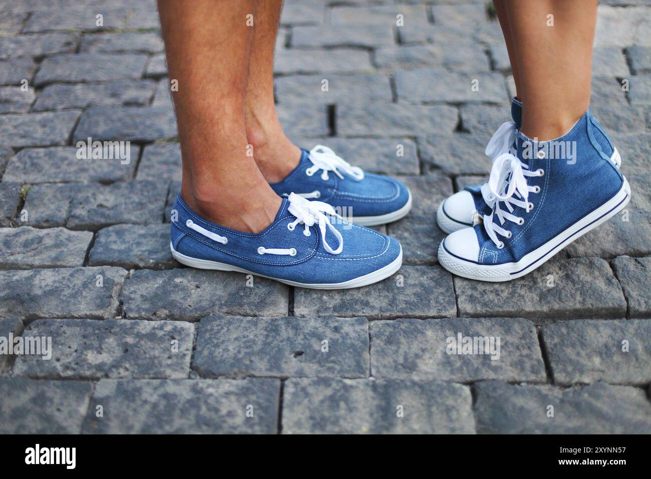 Happy couple. Boyfriend and girlfriend feet wearing sneakers Stock ...