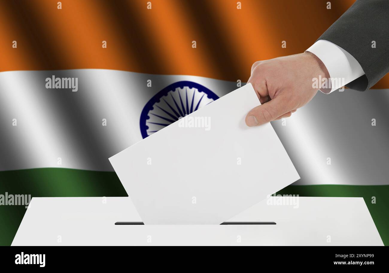 The Indian flag and the hand with the bulletin about the ballot box ...