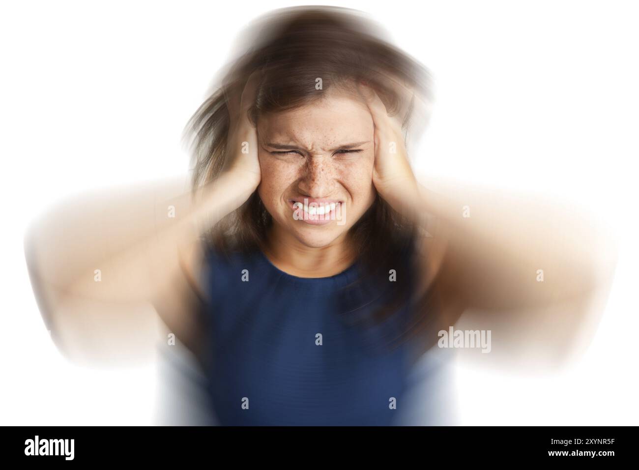 Woman suffering from an headache, holding her hands to the head, with ...