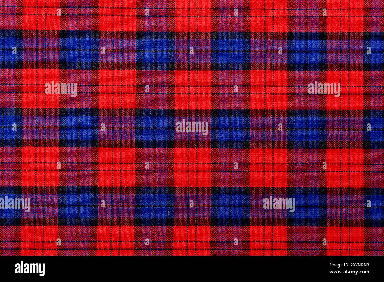 The texture of linen fabric in a large cage of blue, red and white ...