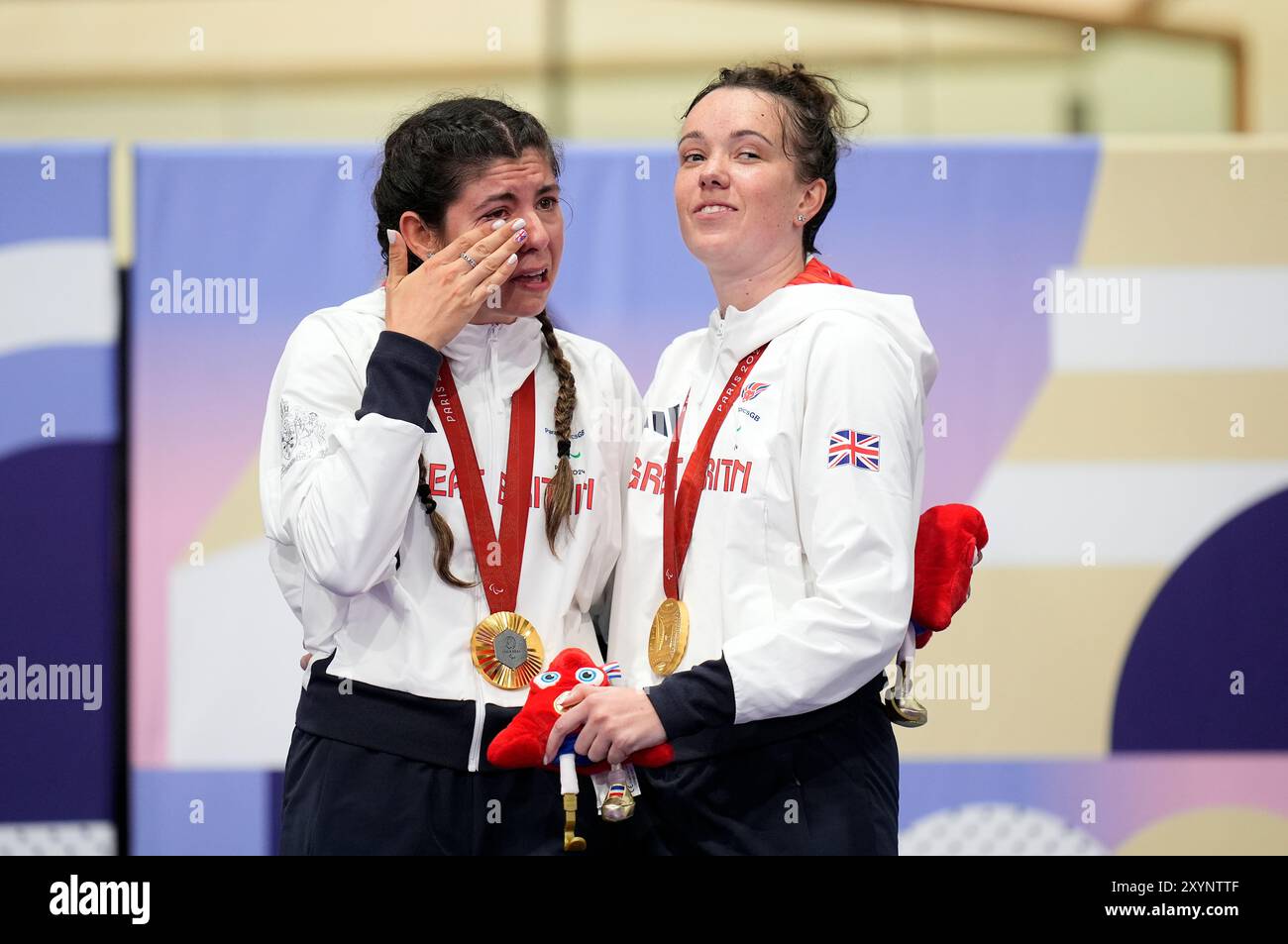 Geat Britain's Elizabeth Jordan and pilot Dannielle Khan receive their ...