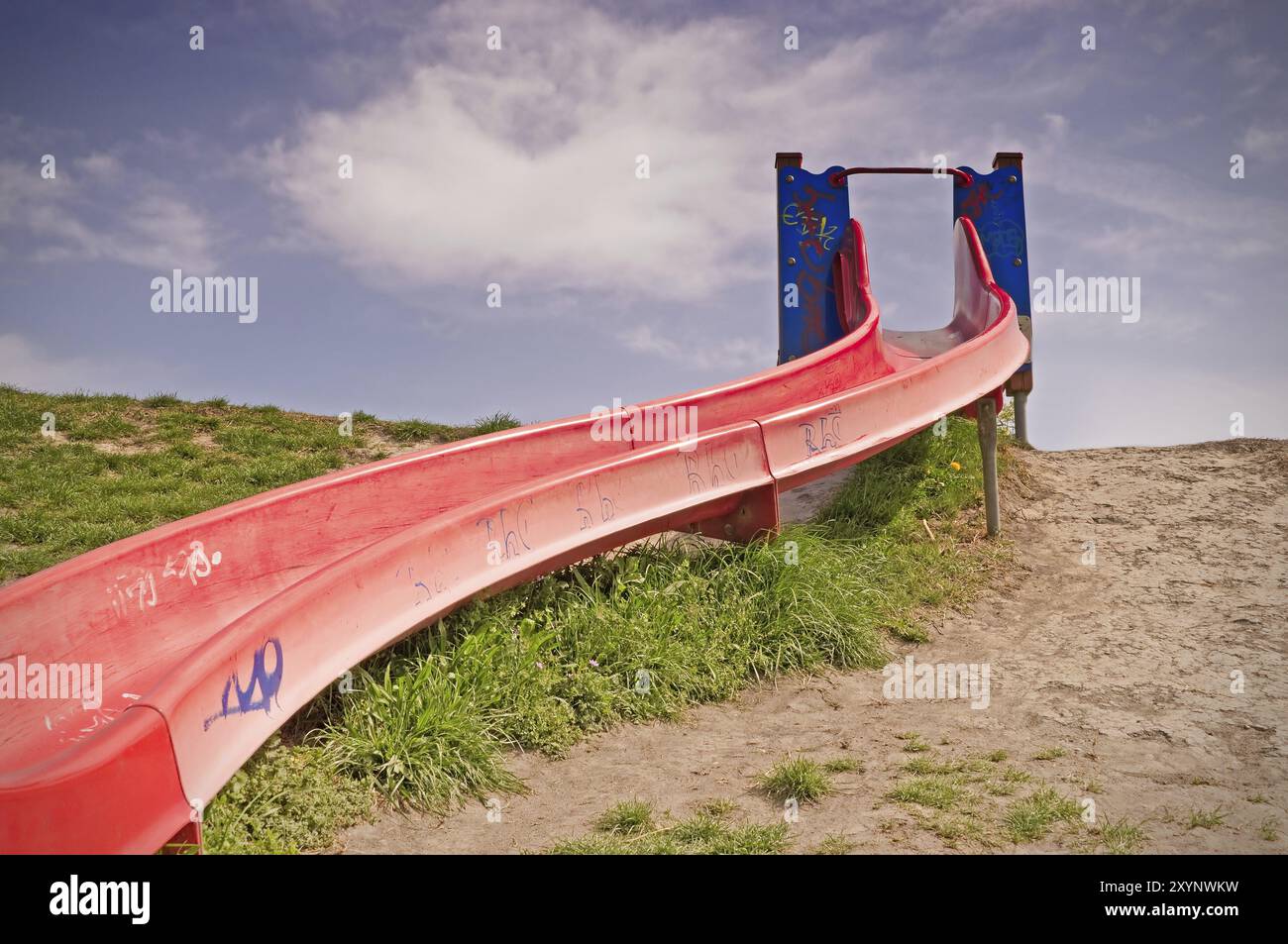 Colorful photo of a long shabby slide Stock Photo - Alamy