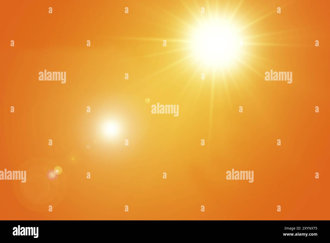 Orange-coloured sun with glare spots Stock Photo - Alamy