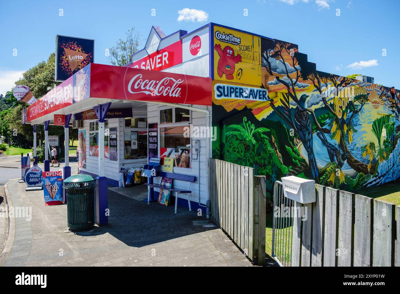 A small convenience store decorated with a colourful mural in ...