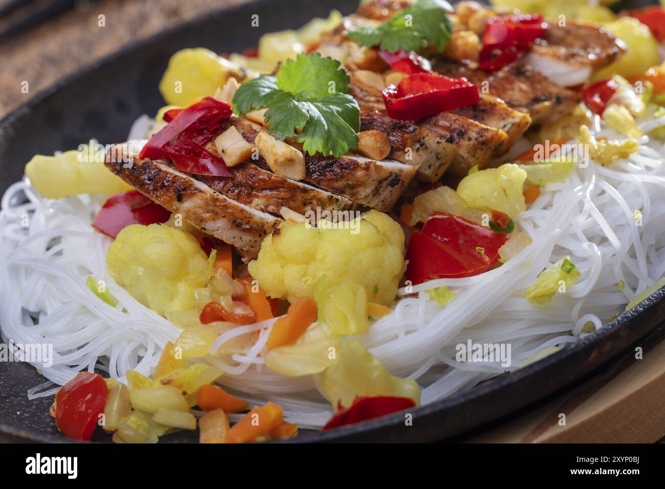 Hot sizzler on wood Stock Photo - Alamy
