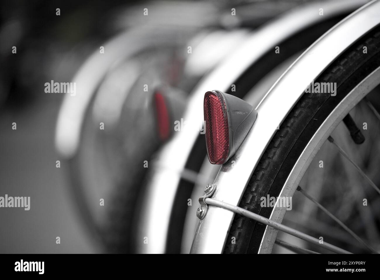 Rear red reflectors on bike wheels Stock Photo - Alamy
