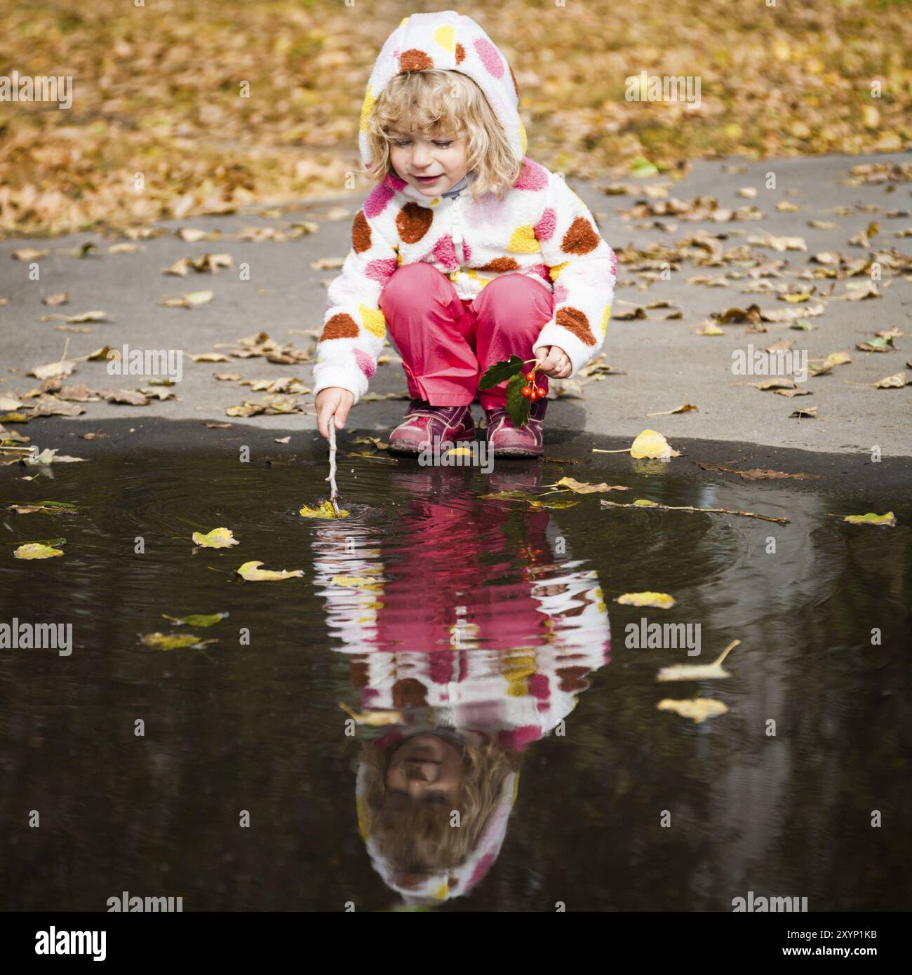Children playing puddle hi-res stock photography and images - Alamy