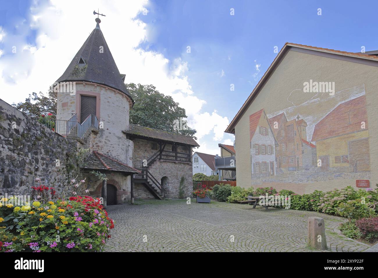 Historic stag tower built in 1330 and building with mural painting in ...