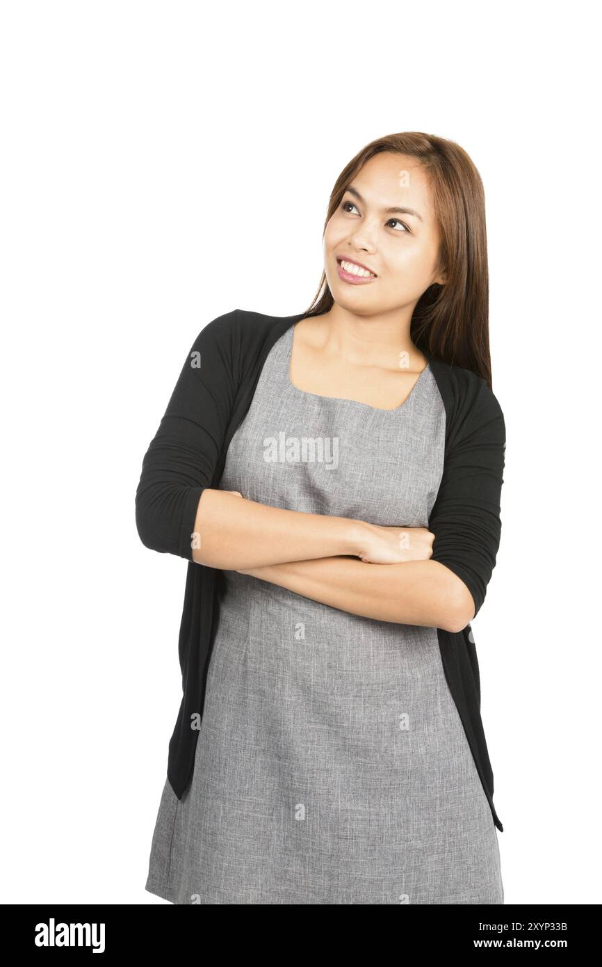 A curious, modern Asian woman with cheerful, smiling facial expression ...