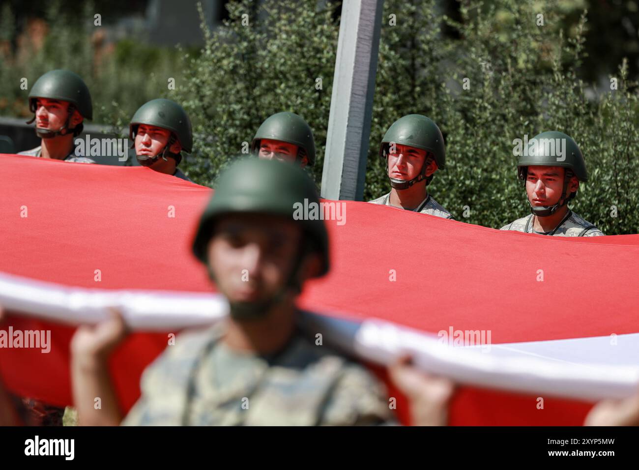 Soldiers of the Turkish Armed Forces (TSK) carry the Turkish flag ...