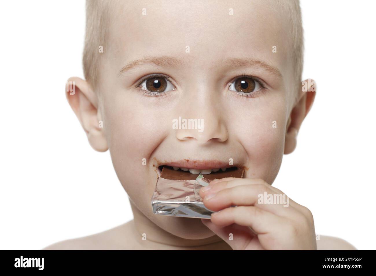 Little child holding sweet chocolate candy food Stock Photo - Alamy