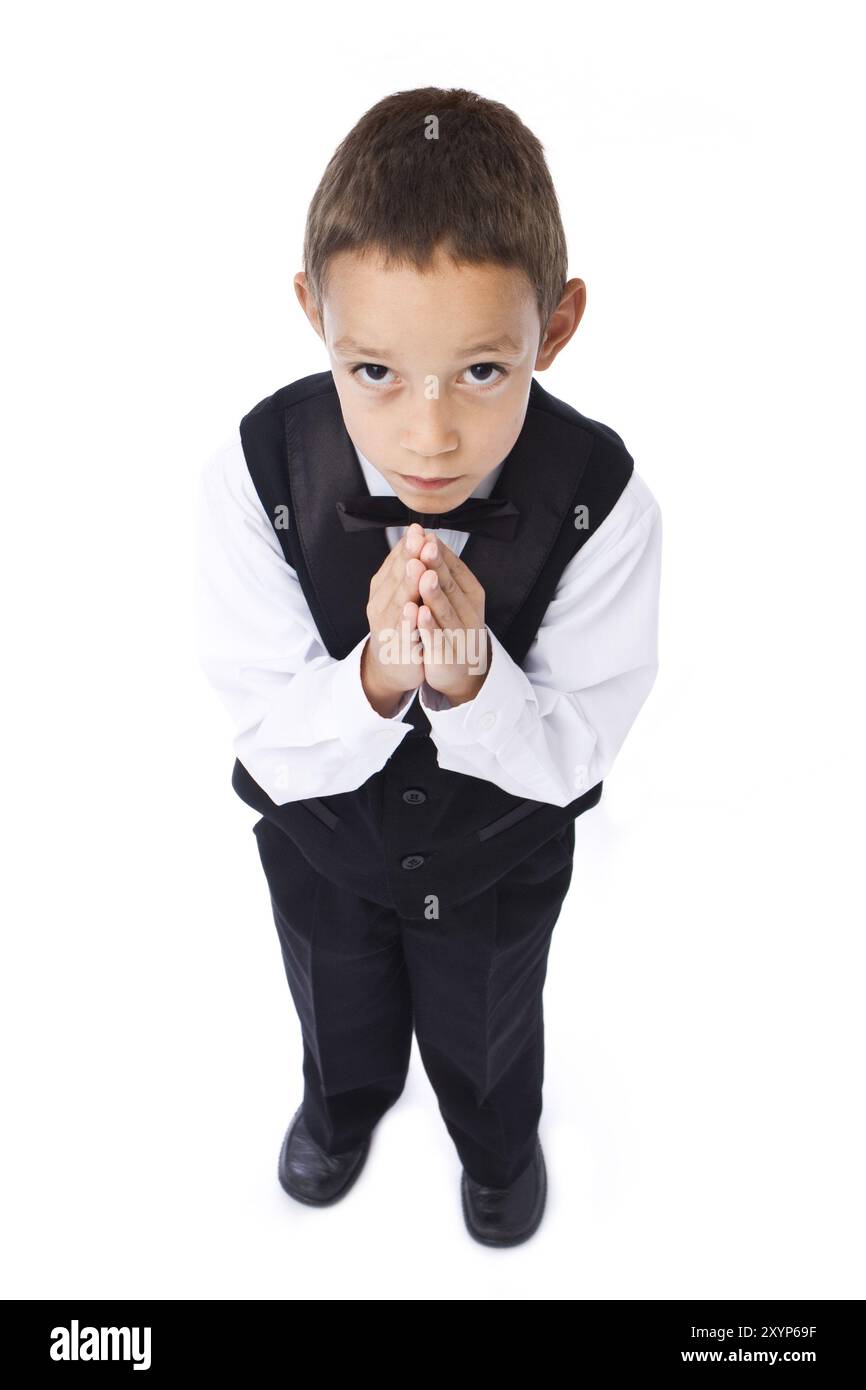 Little boy praying isolated on white Stock Photo - Alamy