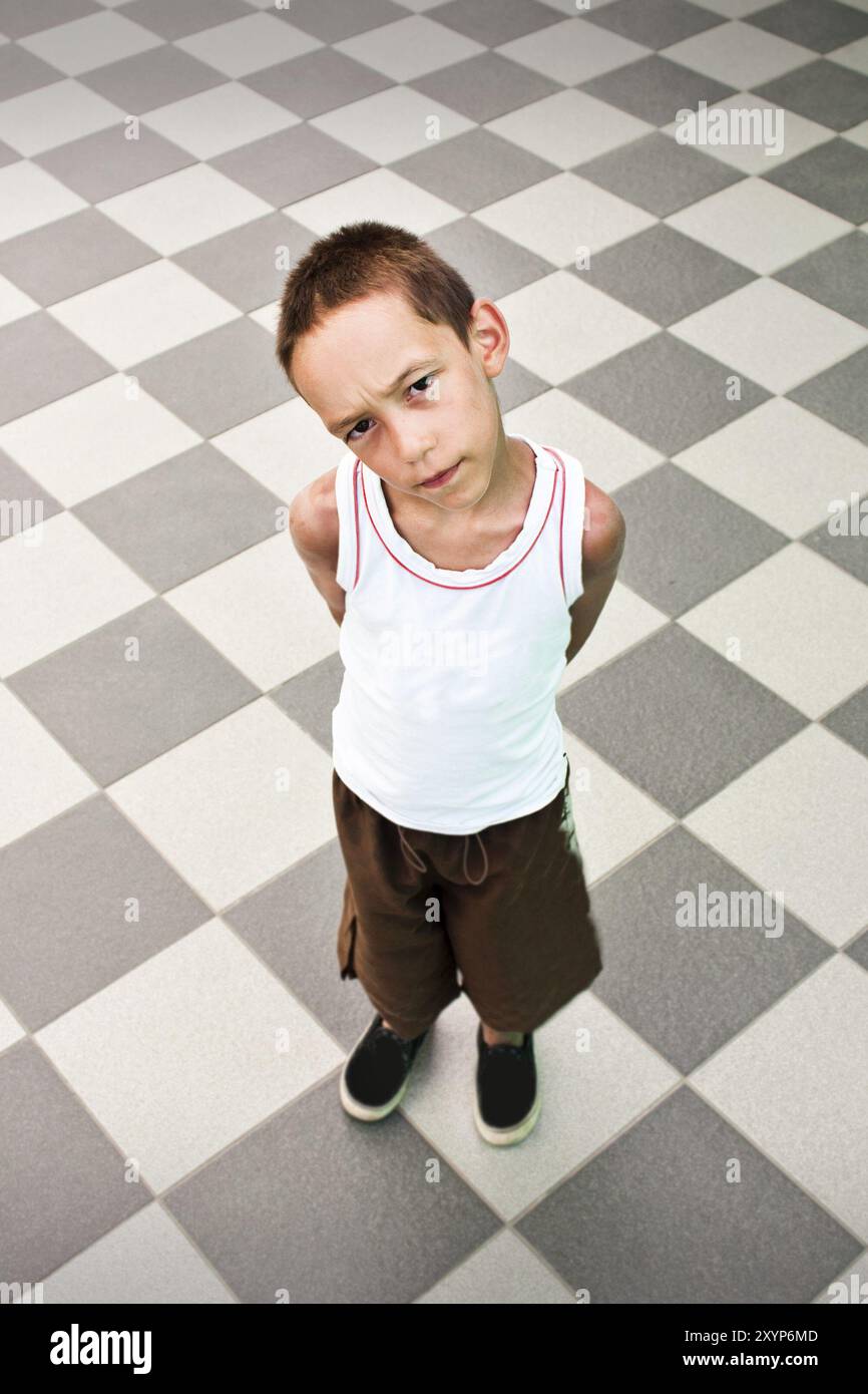 Suspicious boy standing alone over black and white background Stock ...