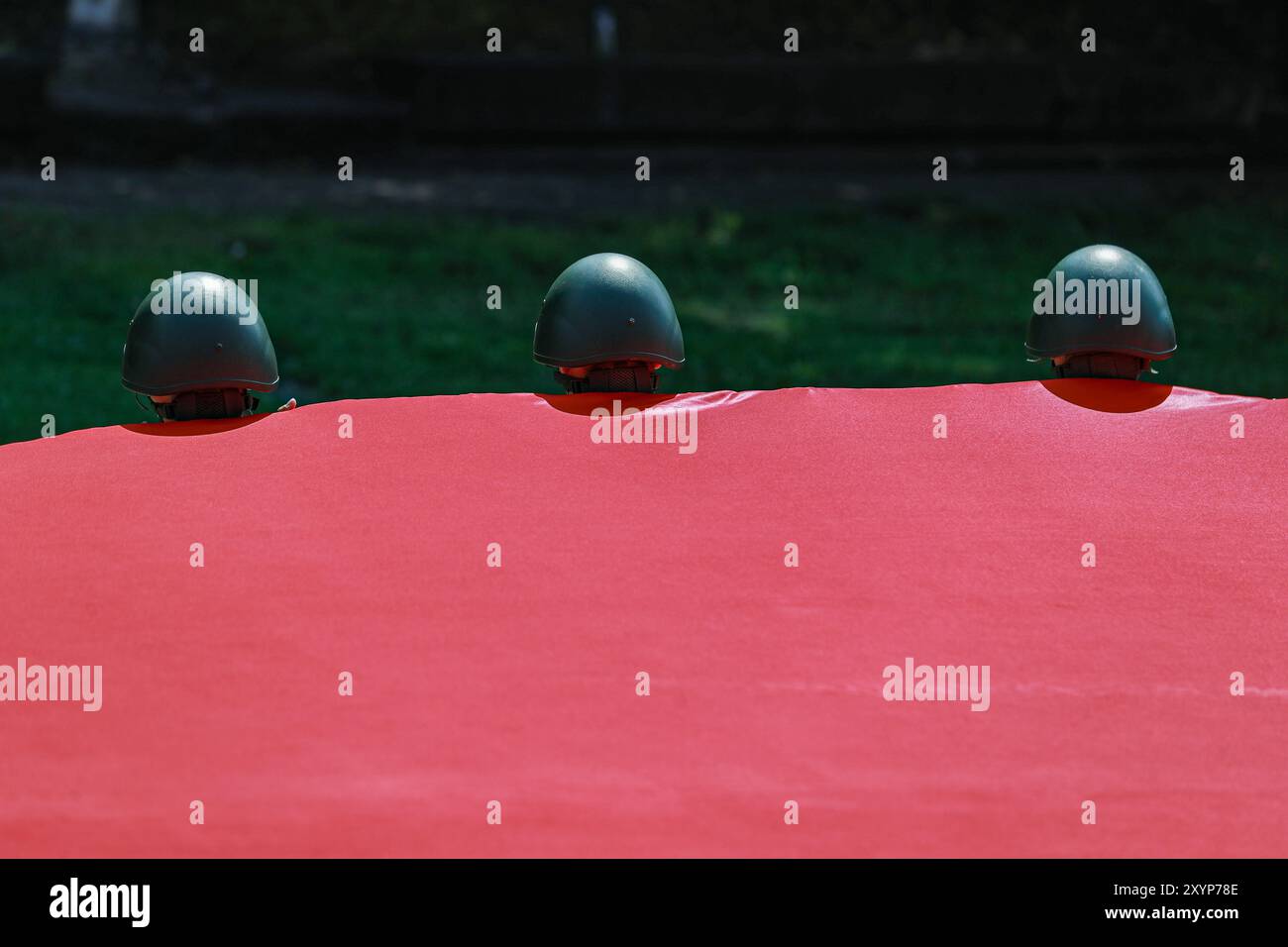 Three soldiers of the Turkish Armed Forces (TSK) hold the Turkish flag ...