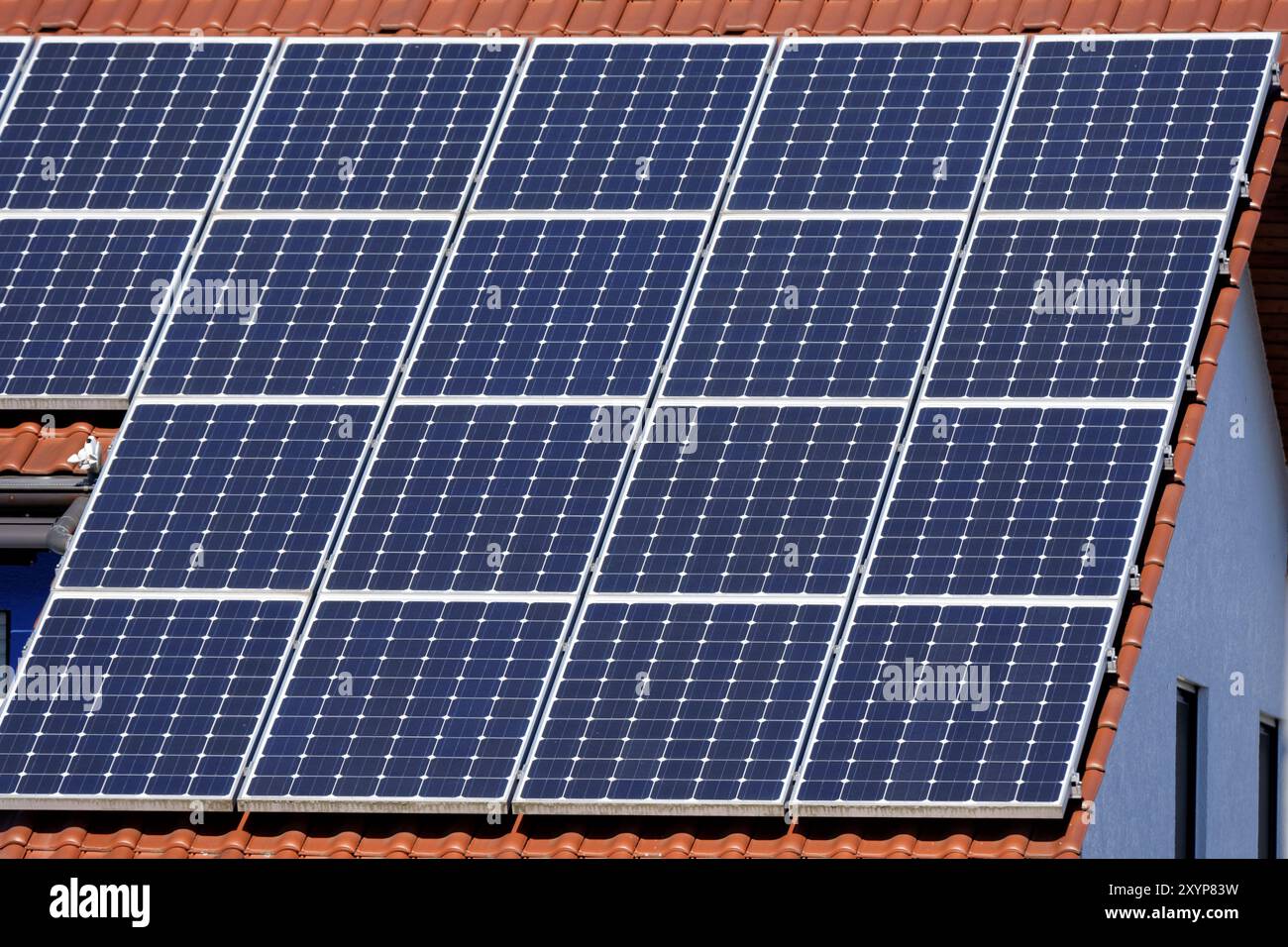 Solar cells on a house roof Stock Photo - Alamy
