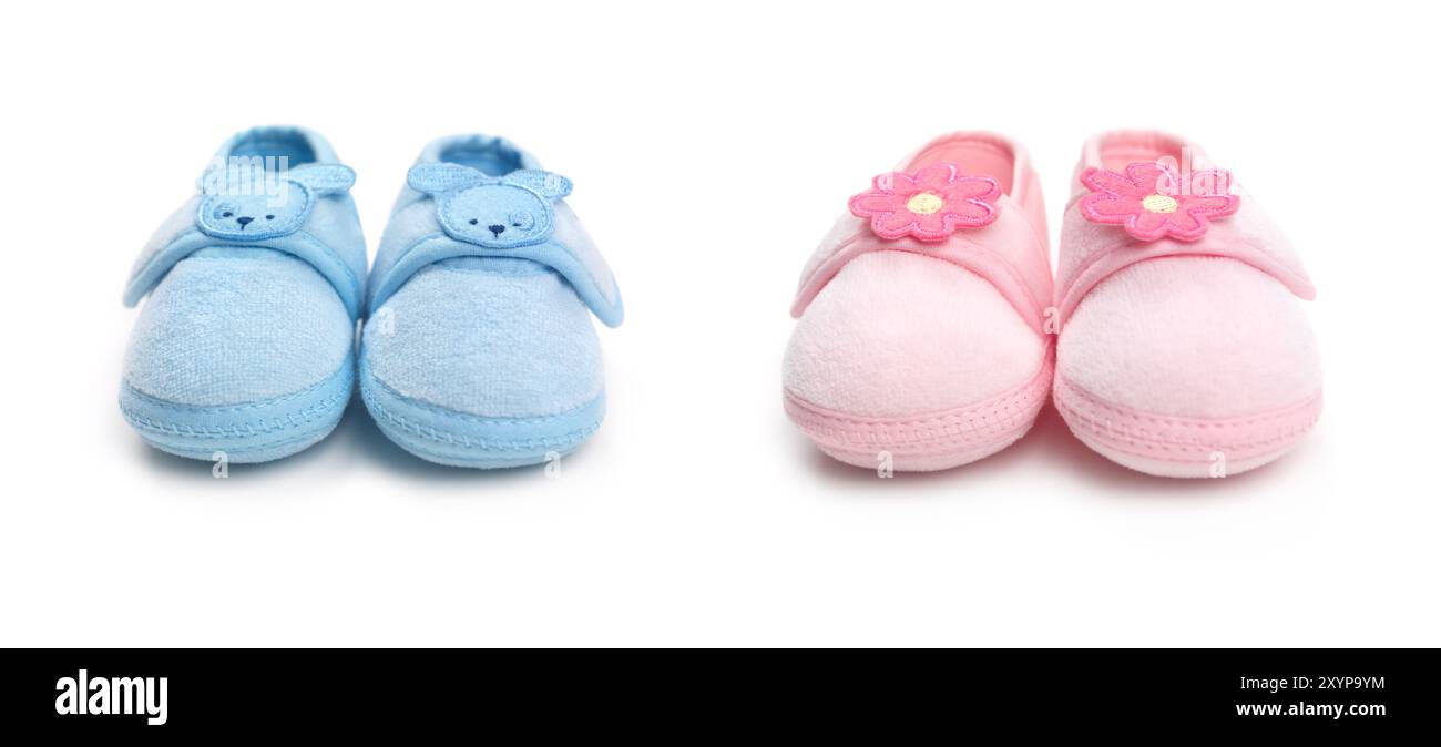 Closeup of cute pink and blue baby boy and girl shoes isolated on white ...