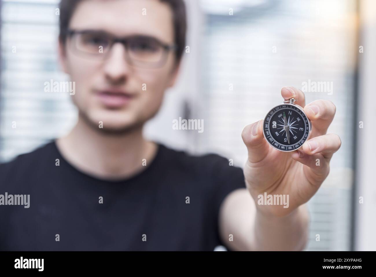 Compass holding in hand hi-res stock photography and images - Alamy