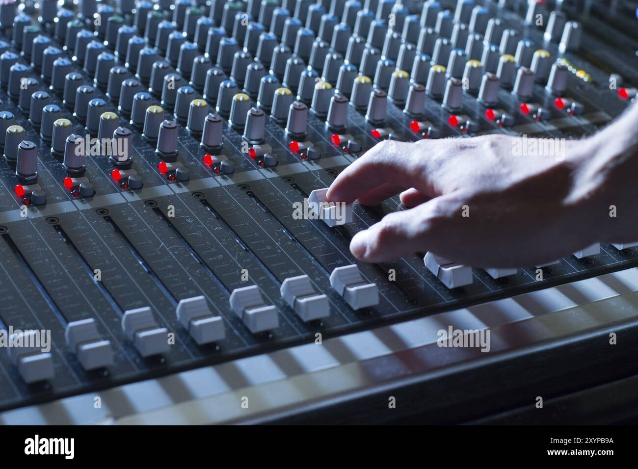 Professional music production in a sound recording studio, mixer desk ...