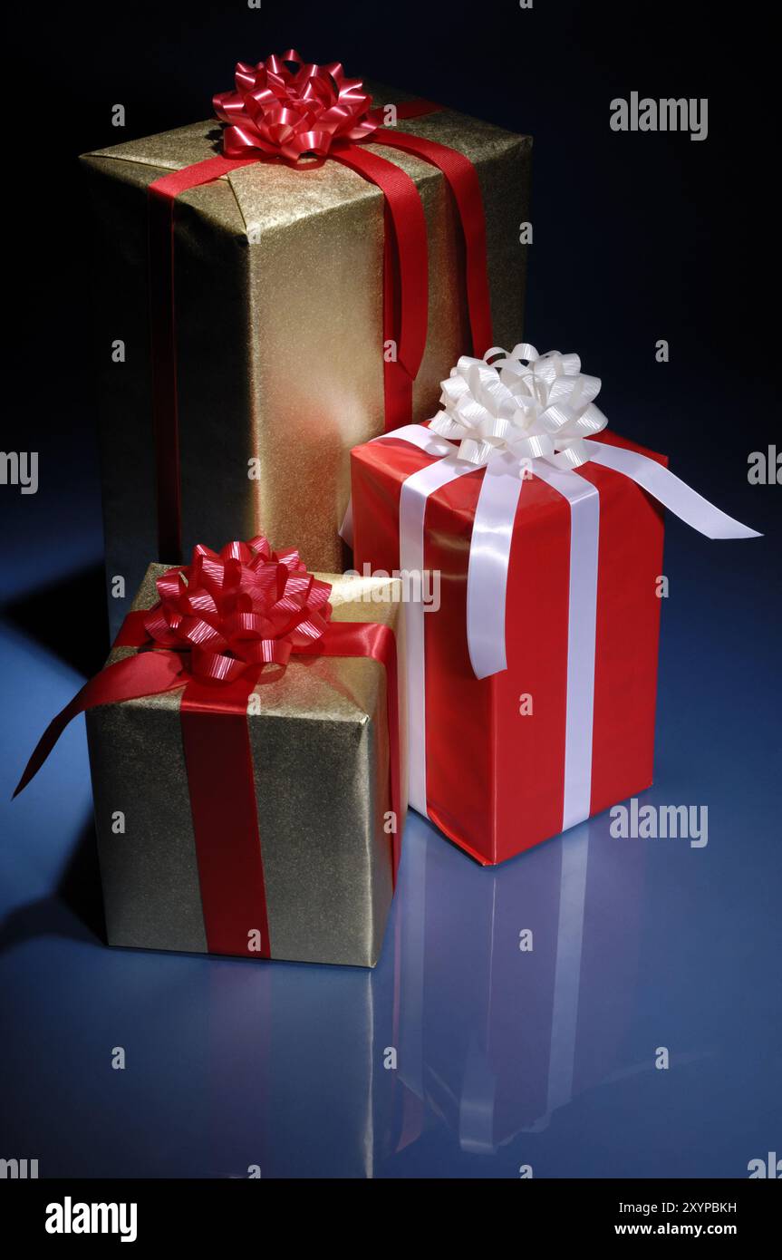 Christmas gift boxes shining in darkness Stock Photo - Alamy