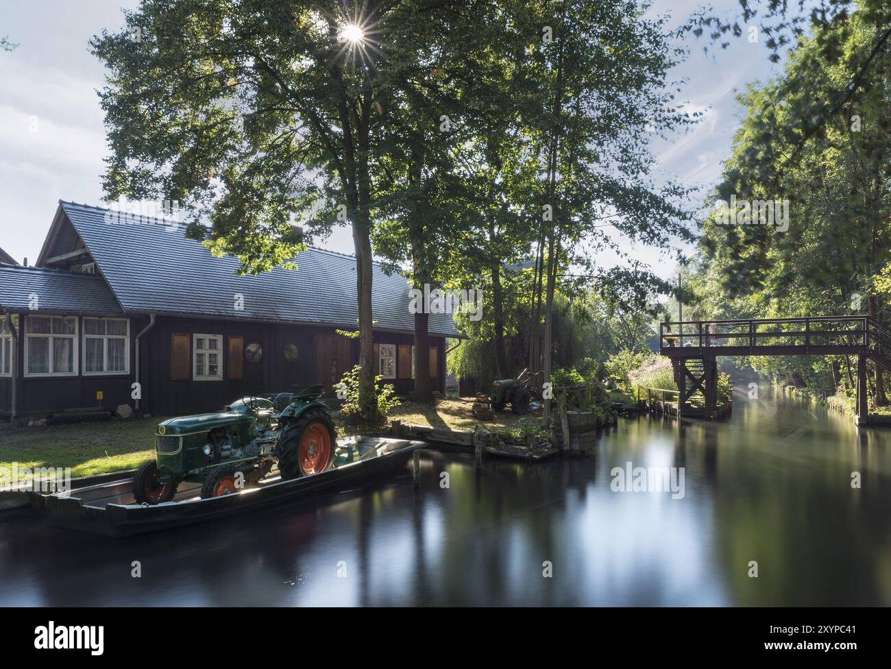 Long exposure. Residential and farmhouse with barge and tractor Stock ...