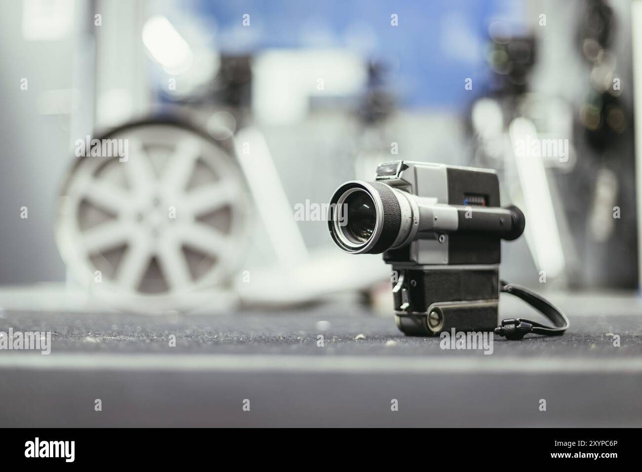 Vintage old movie camera, production studio in the blurry background ...