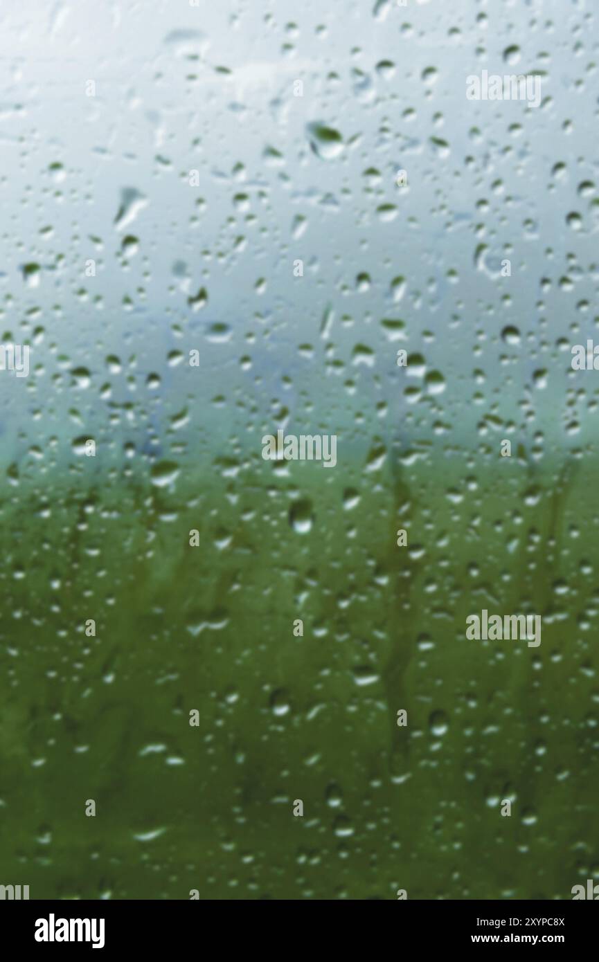 Natural background Drops on both sides of the glass from the rain and ...