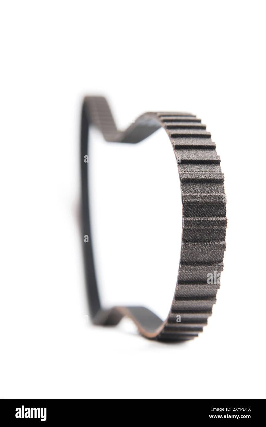 Black new timing belt for gasoline engine on a white isolated ...