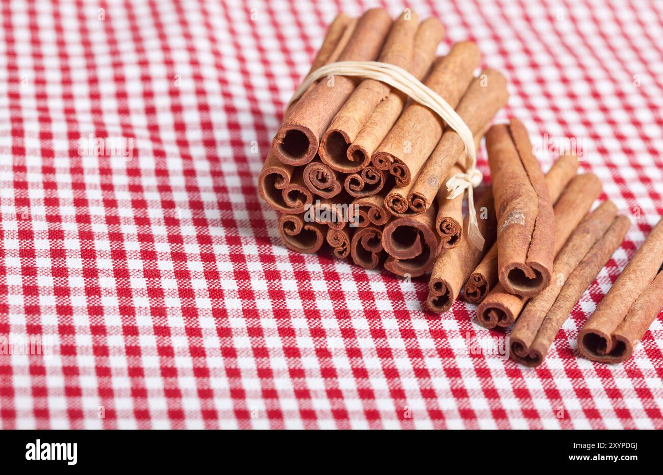 Cinnamon sticks on a chequered cloth Stock Photo - Alamy